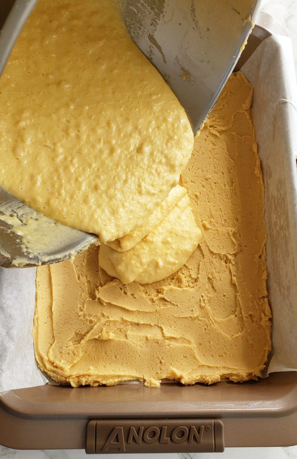 Pour filling over the dough in the pan.