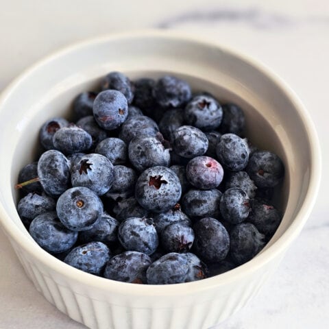 Measure berries into a ramekin. No need to grease the ramekin.